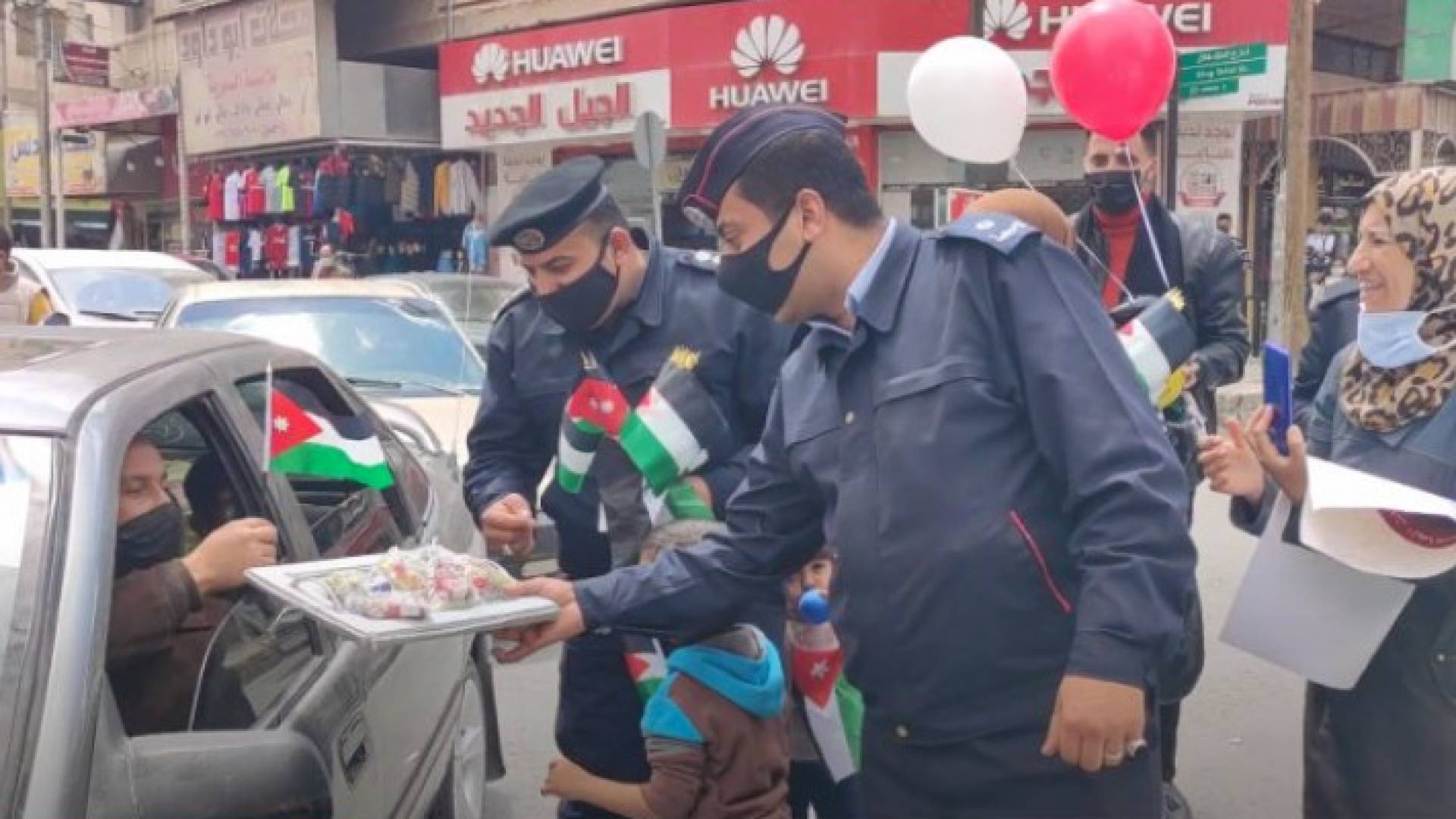 Roya News | Mafraq police distribute flags, sweets in celebration of ...